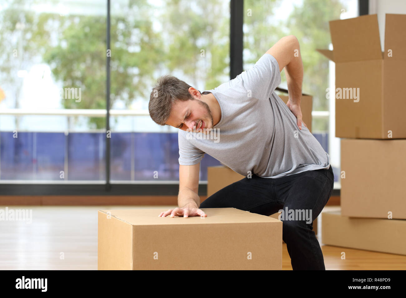 Manual lifting back injury hi-res stock photography and images - Alamy
