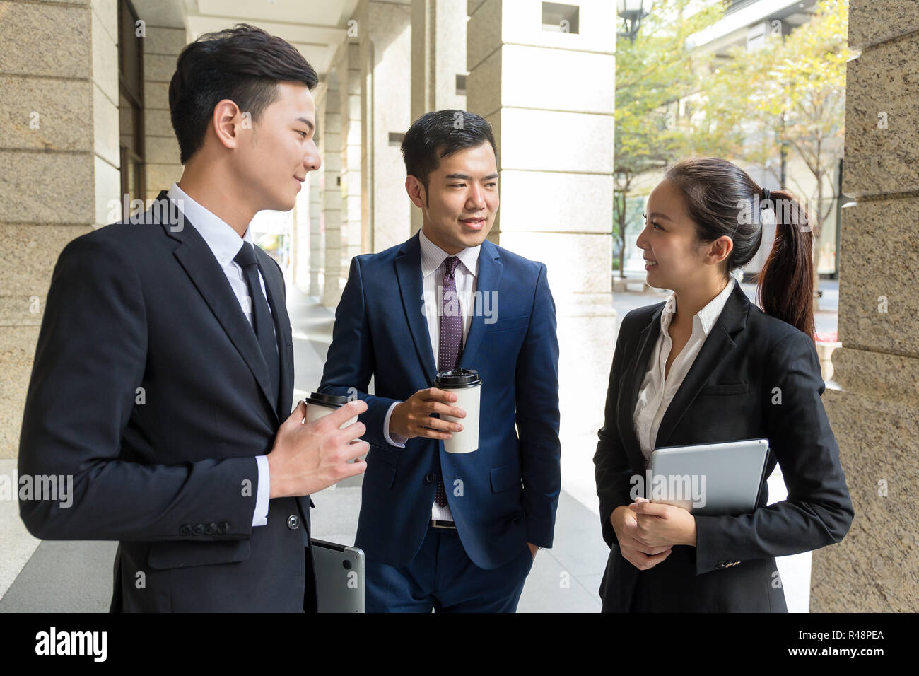 Group of business people talking about the project planning at outdoor ...