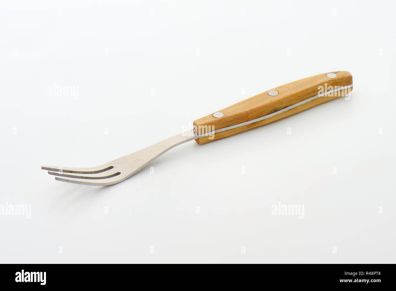 Wooden-handled three-pronged fork Stock Photo - Alamy