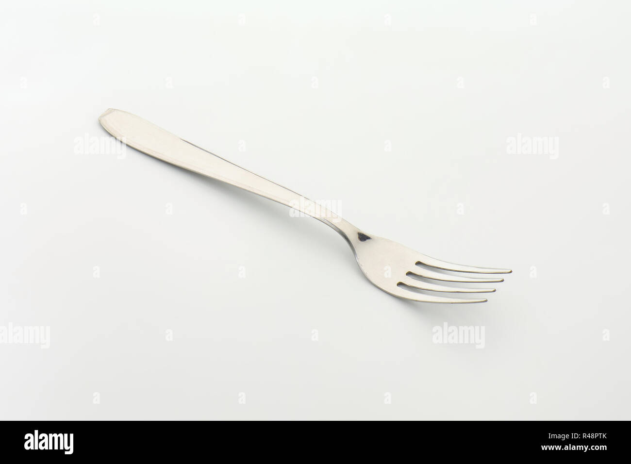 Metal dinner fork Stock Photo - Alamy
