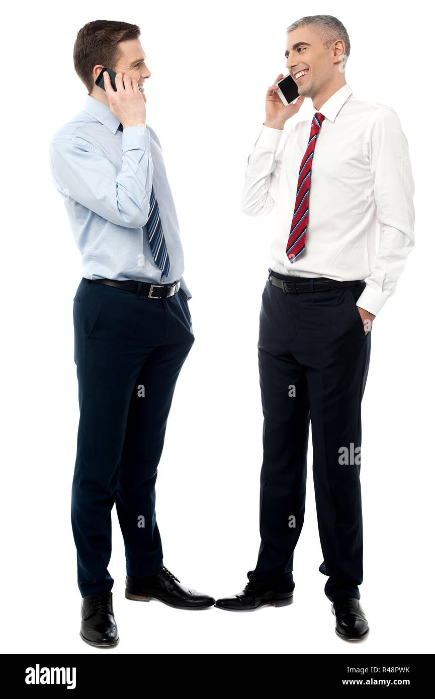 Two men talking standing Cut Out Stock Images & Pictures - Alamy