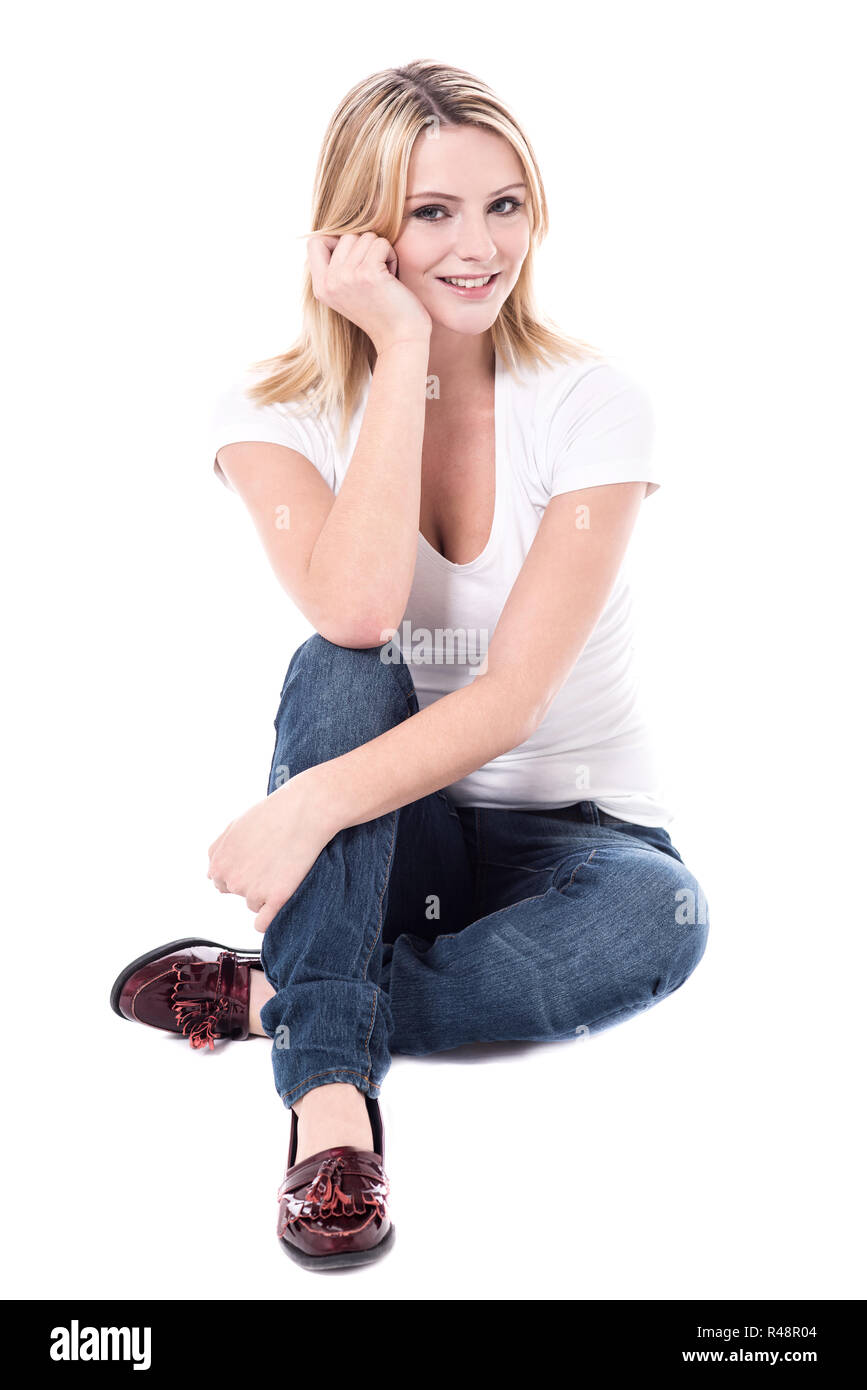Pretty woman sitting on the floor Stock Photo - Alamy