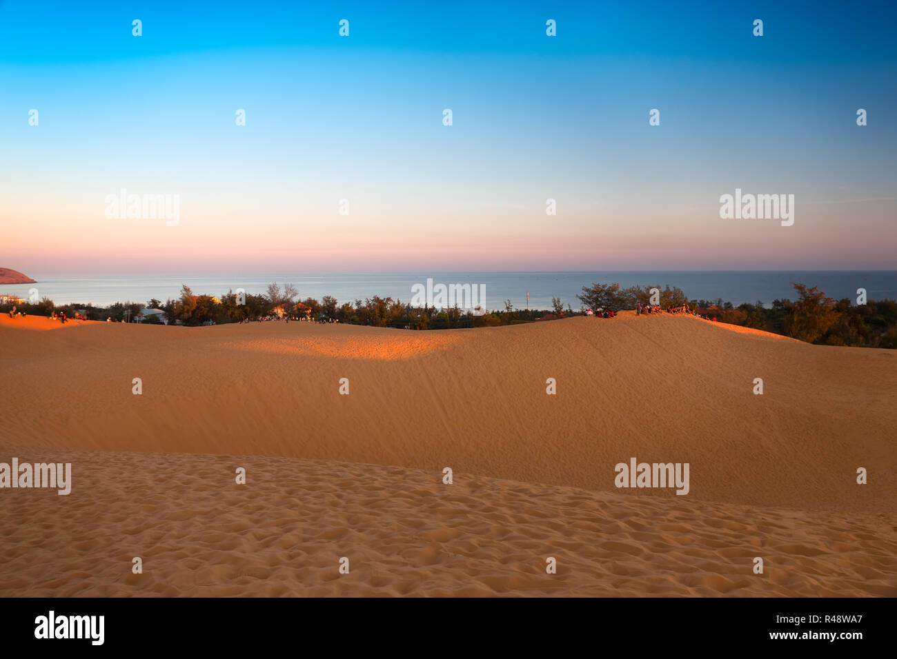 Red sand dunes in Mui Ne at sunset, Vietnam Stock Photo - Alamy