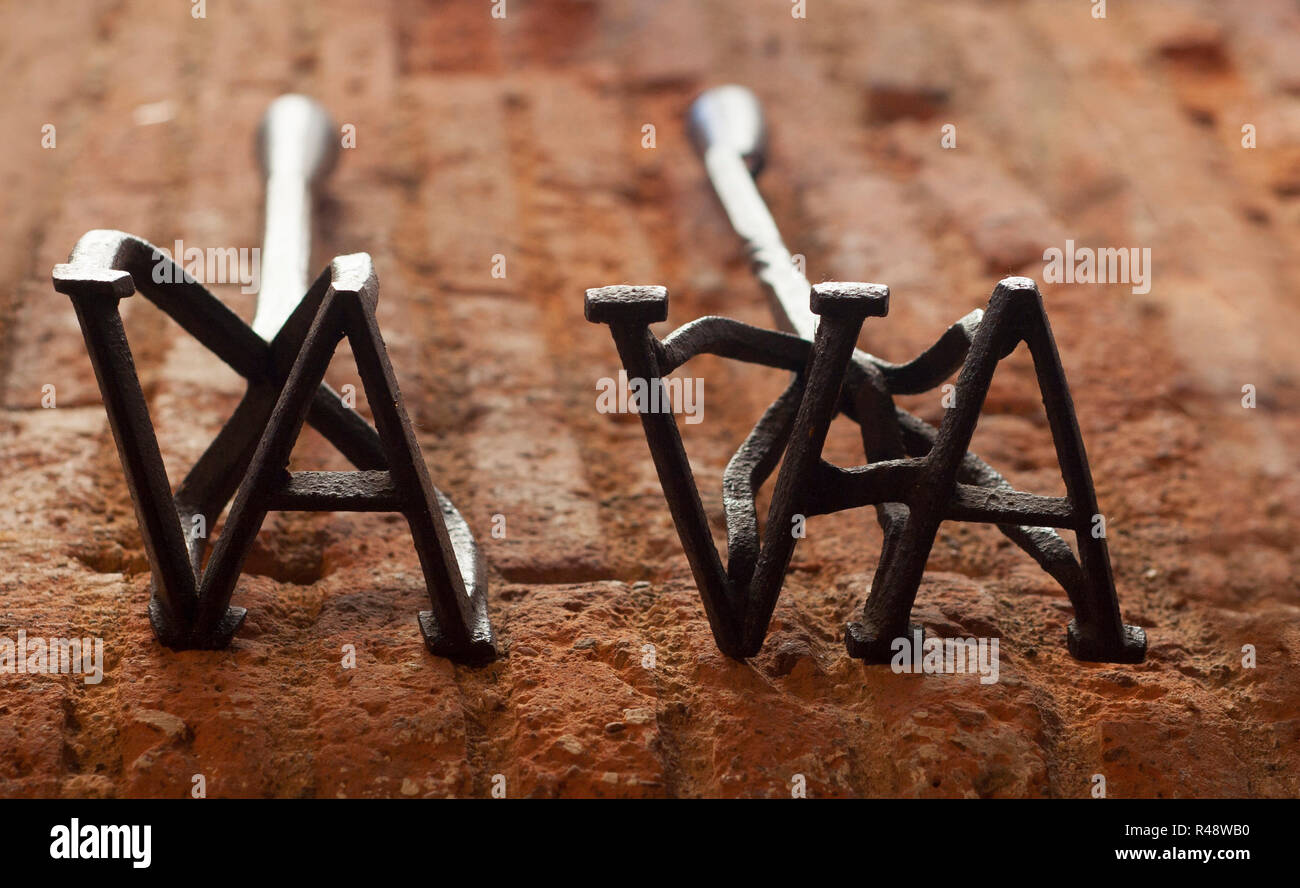 Branding irons hi-res stock photography and images - Alamy