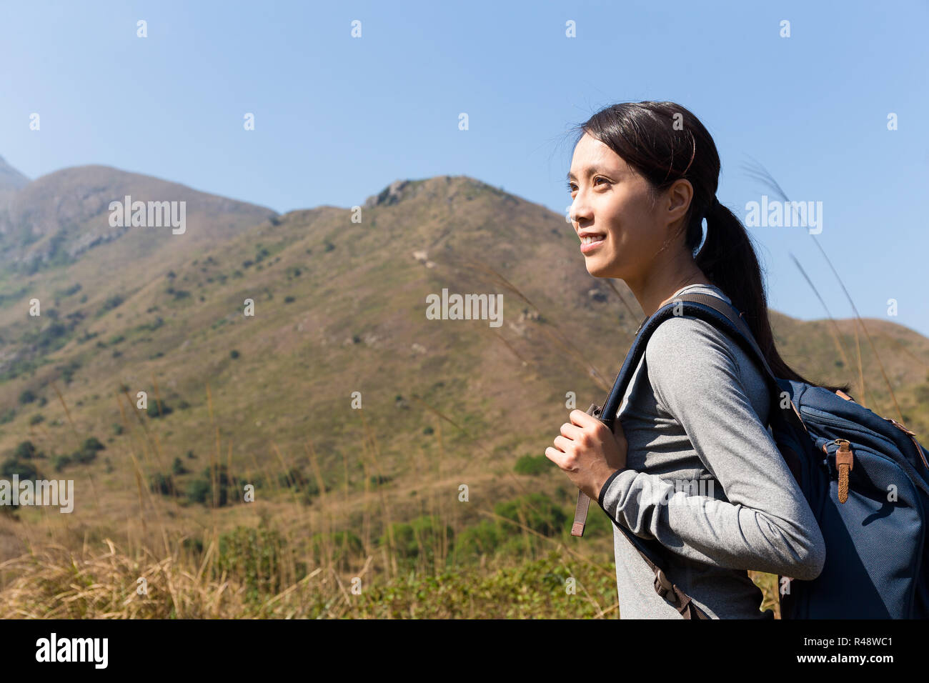 Woman go hiking Stock Photo - Alamy
