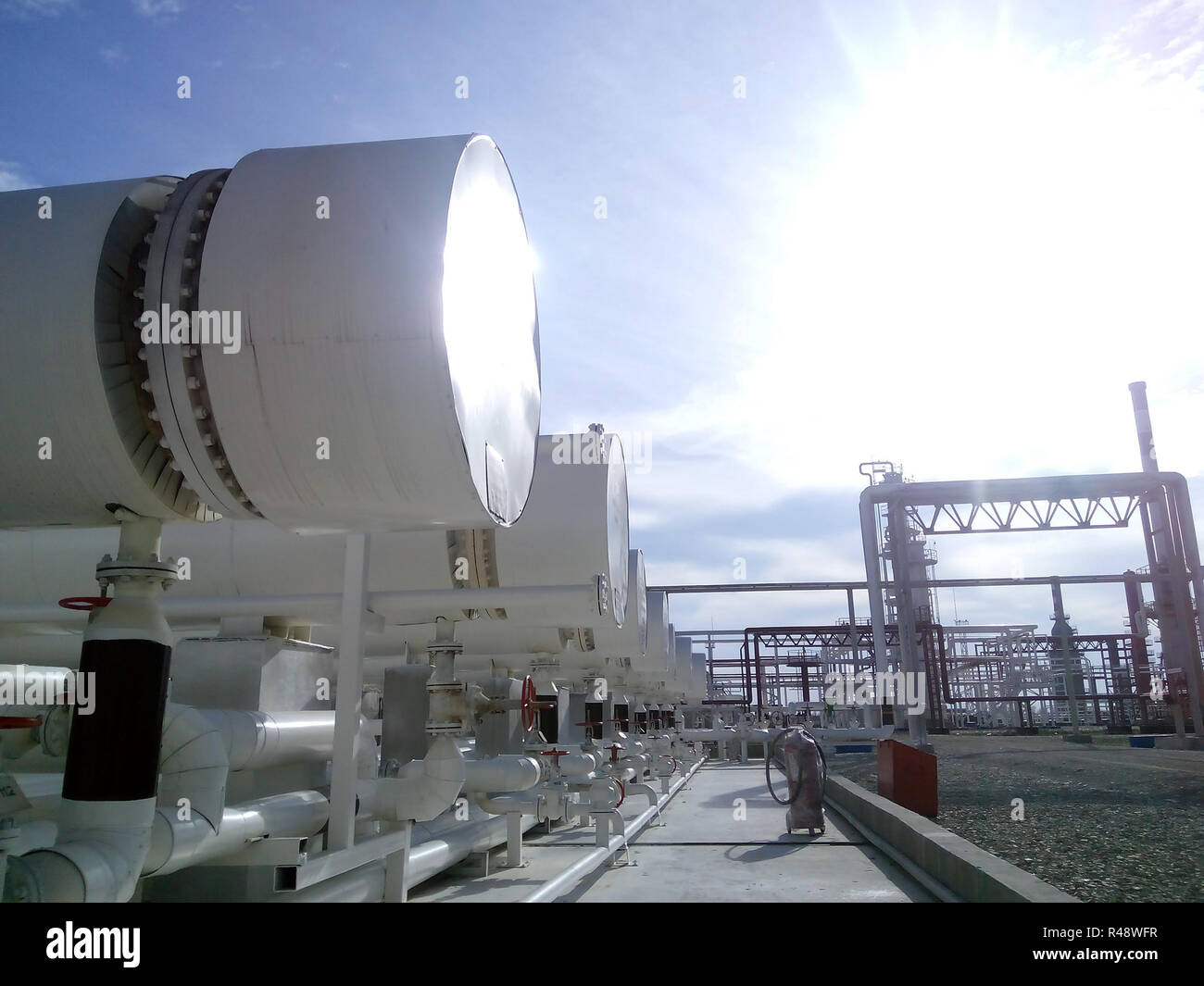 Heat exchangers in a refinery Stock Photo - Alamy