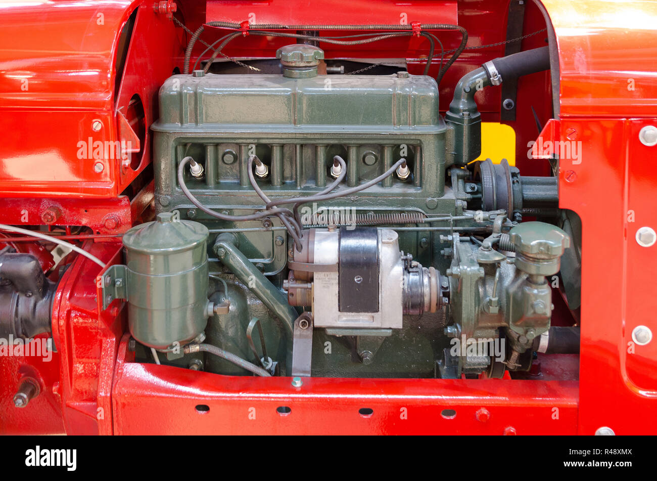 a green diesel engine i a red tractor Stock Photo - Alamy
