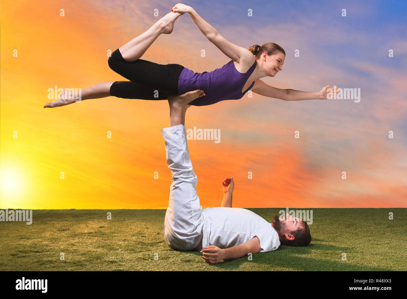The two people doing yoga exercises Stock Photo - Alamy