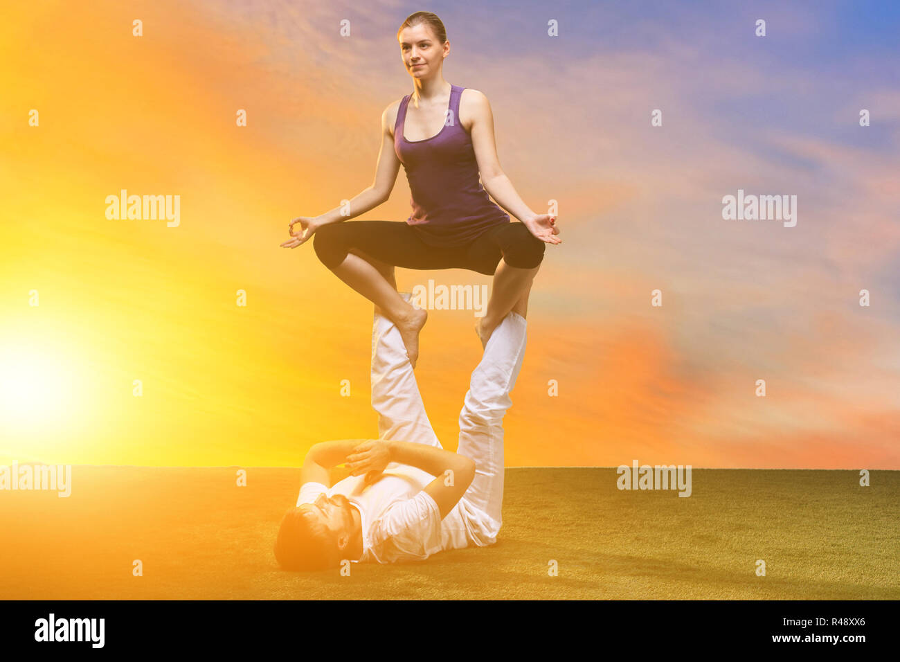 The two people doing yoga exercises Stock Photo - Alamy