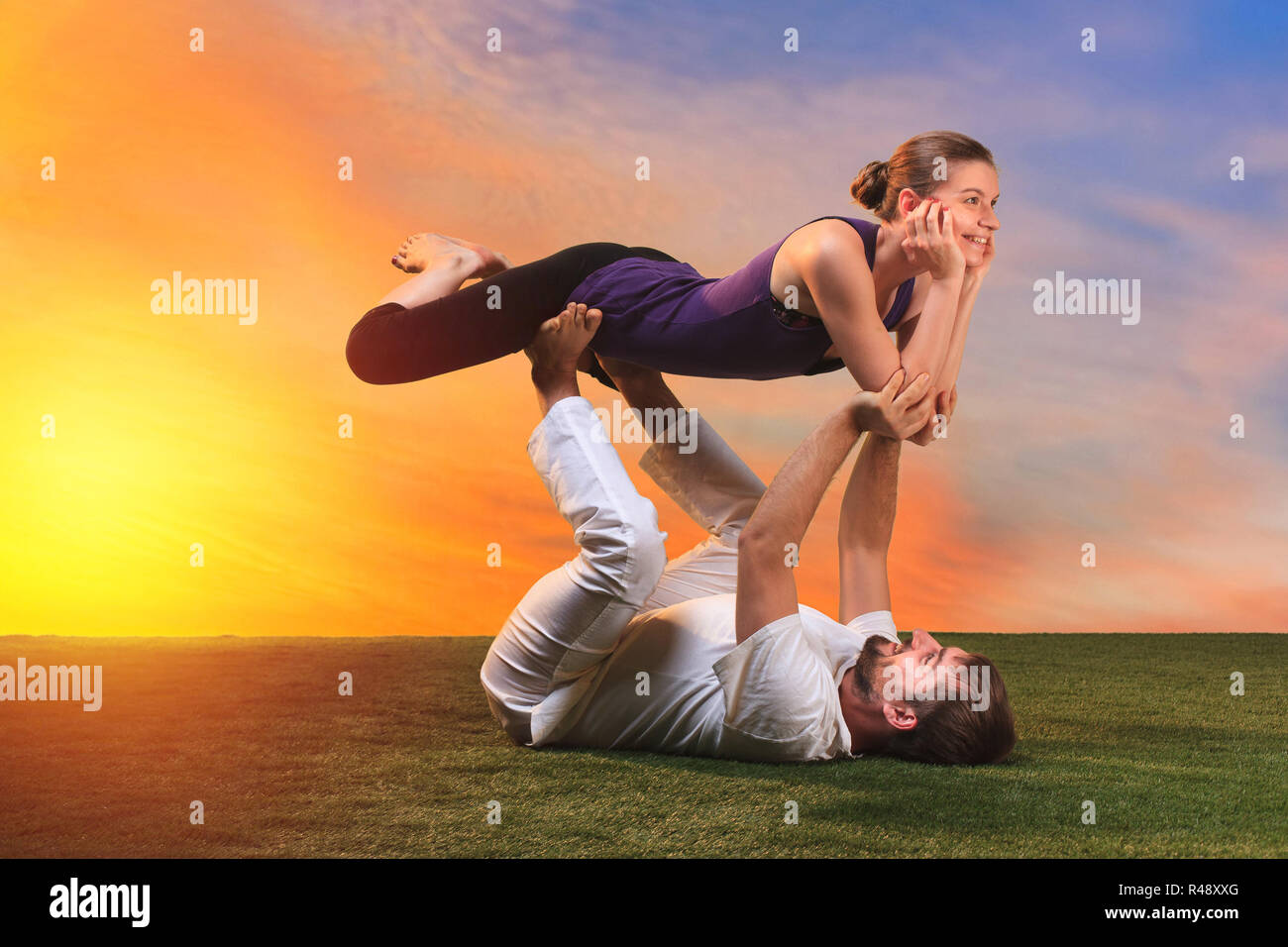 The two people doing yoga exercises Stock Photo - Alamy