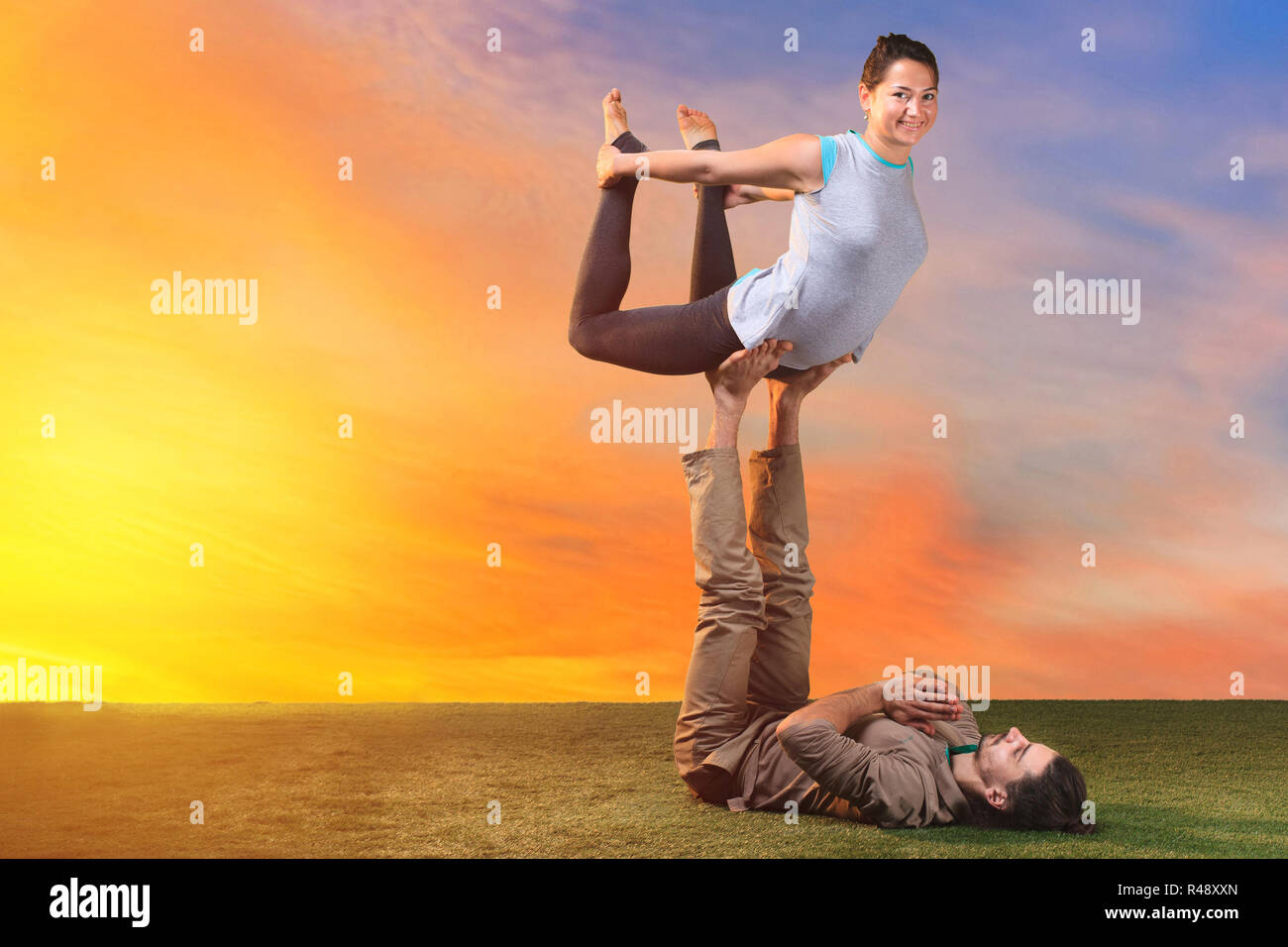 The two people doing yoga exercises Stock Photo - Alamy