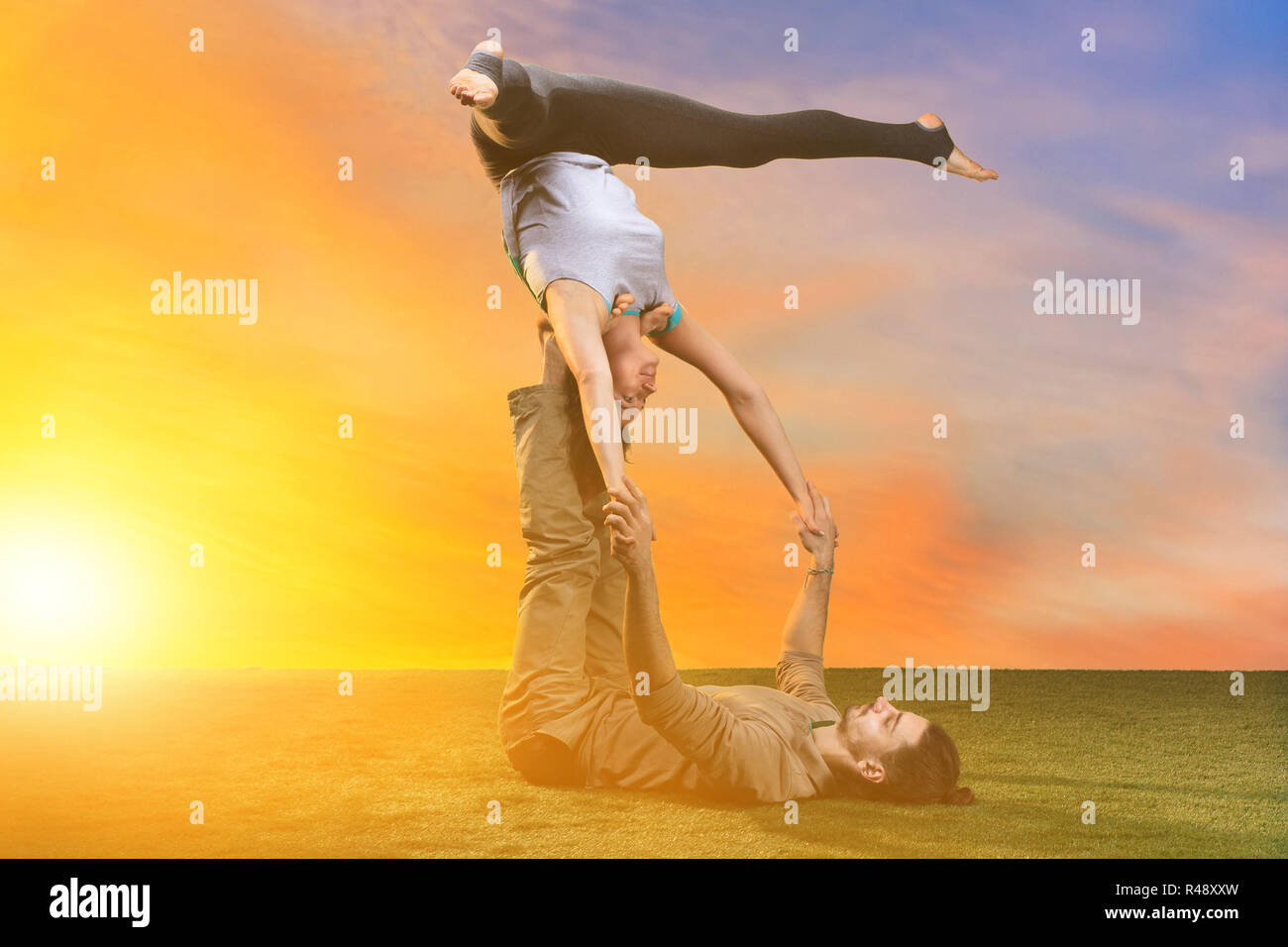The two people doing yoga exercises Stock Photo - Alamy