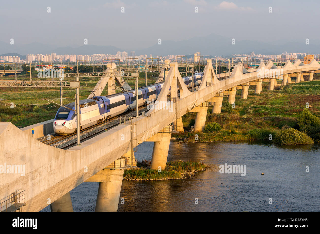 Korea train over a river Stock Photo - Alamy