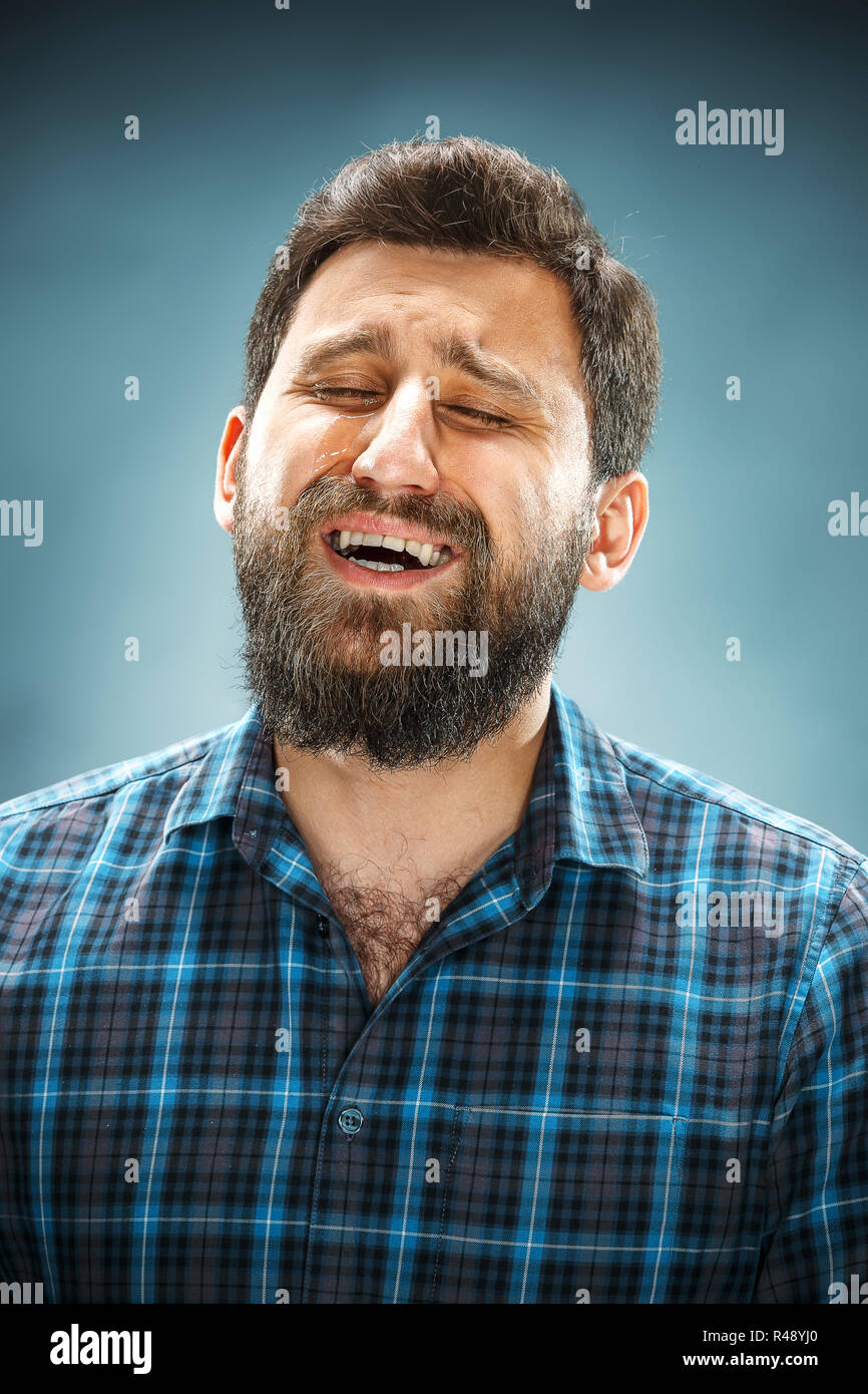 The crying man with tears on face closeup Stock Photo - Alamy