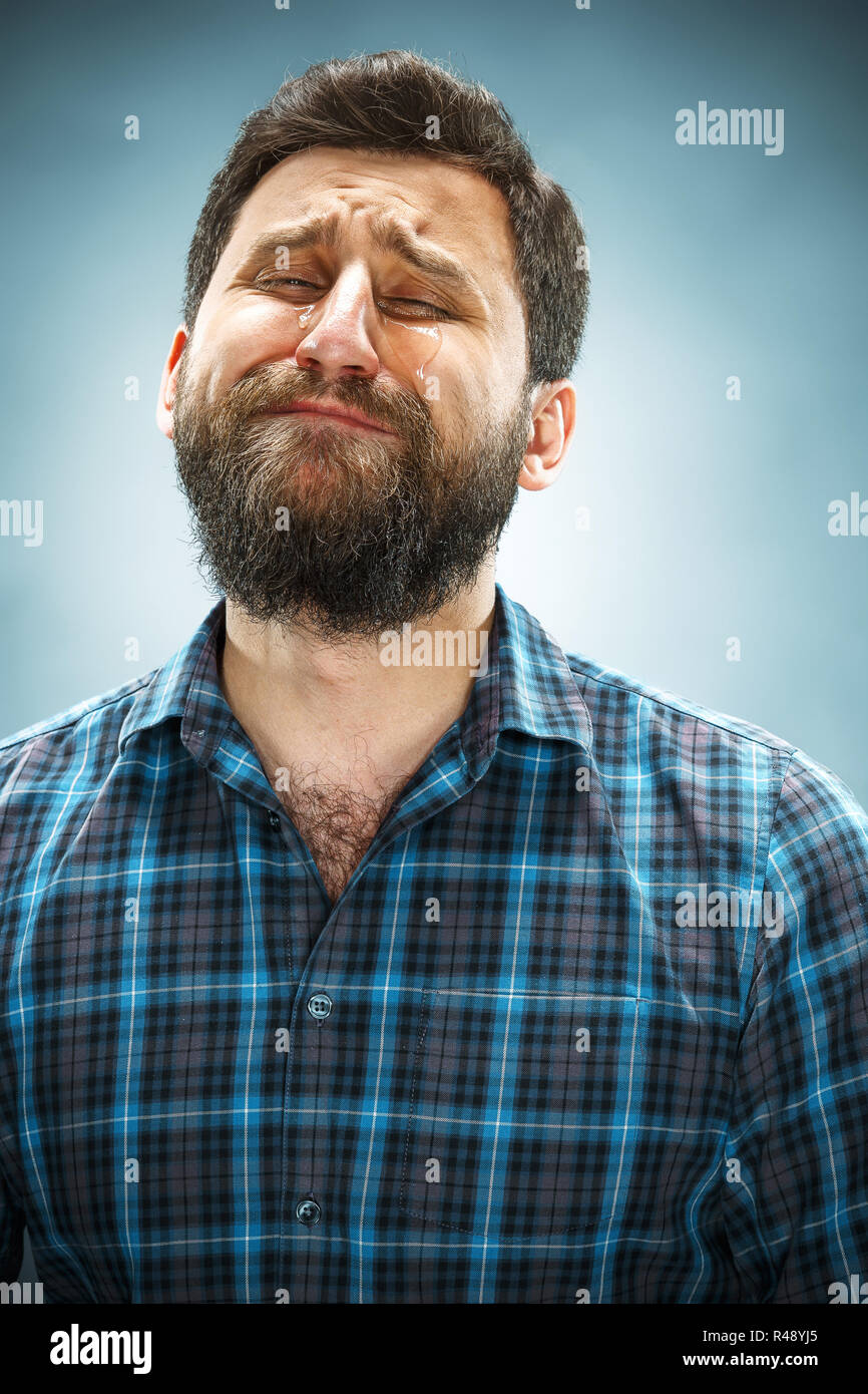 The crying man with tears on face closeup Stock Photo - Alamy