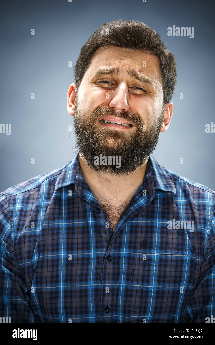 The crying man with tears on face closeup Stock Photo - Alamy