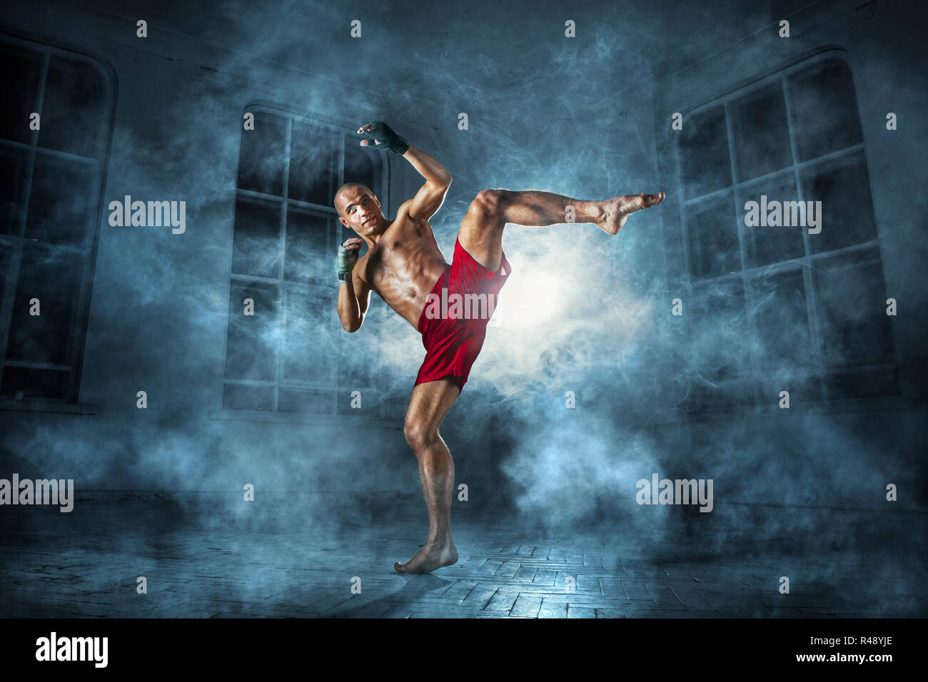 The young man kickboxing Stock Photo - Alamy
