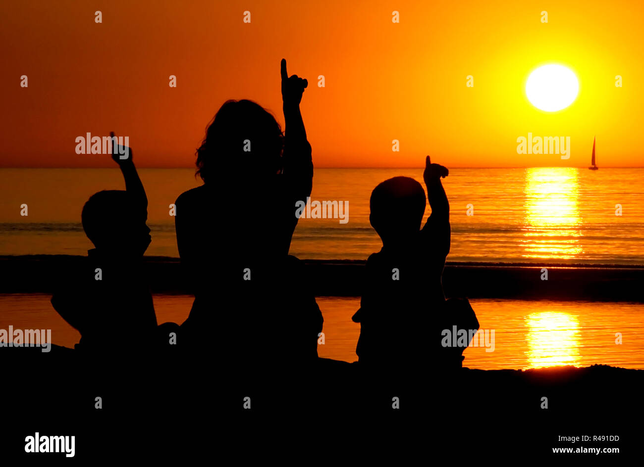 Family Pointing At The Sun Stock Photo - Alamy