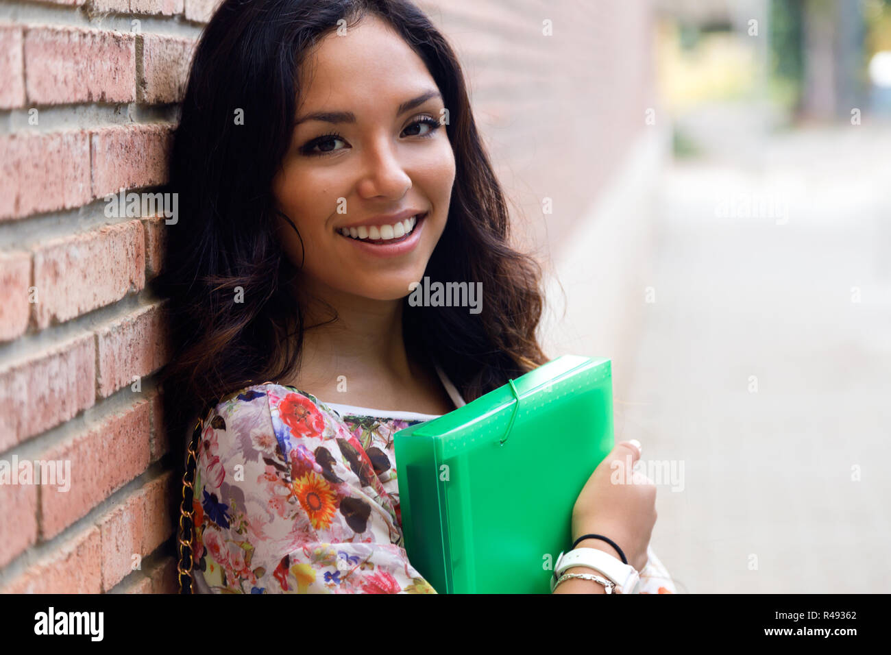 Pretty student girl in the street Stock Photo - Alamy