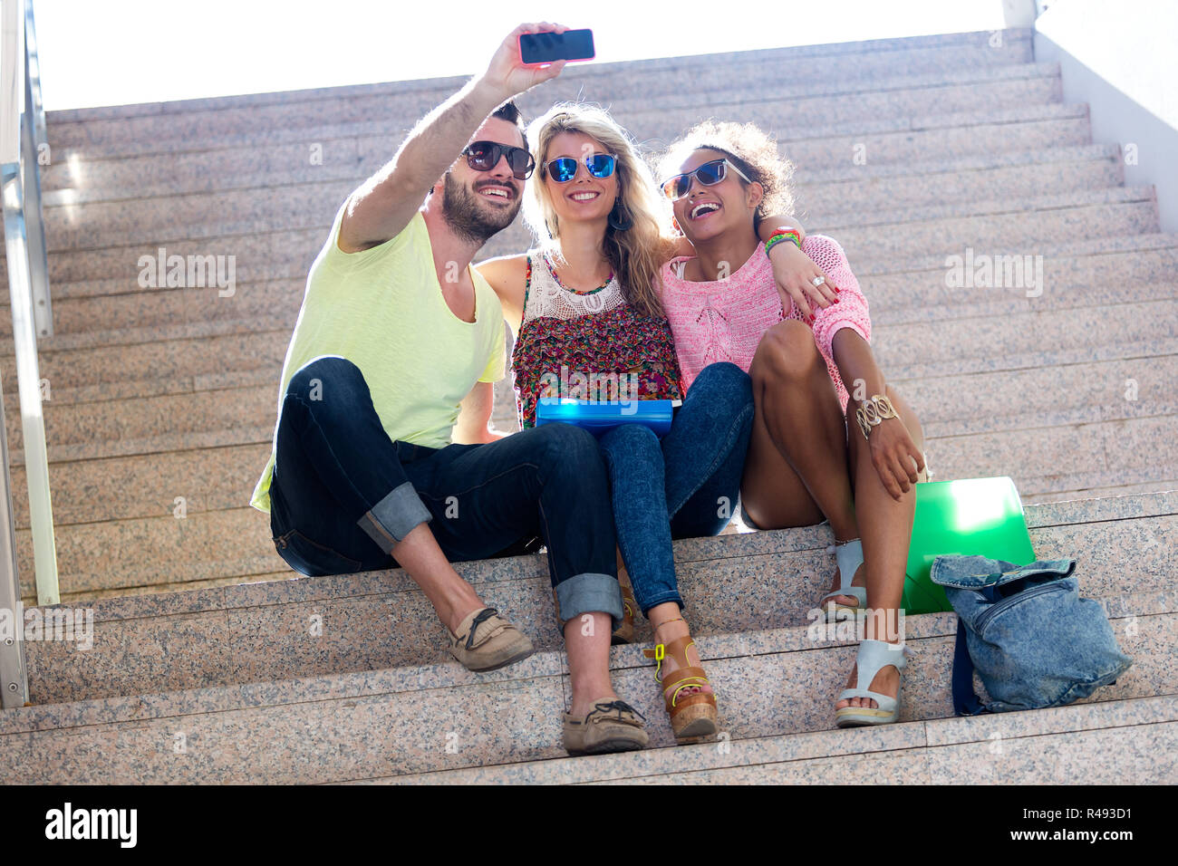 Three university students taking a selfie in the street Stock Photo - Alamy