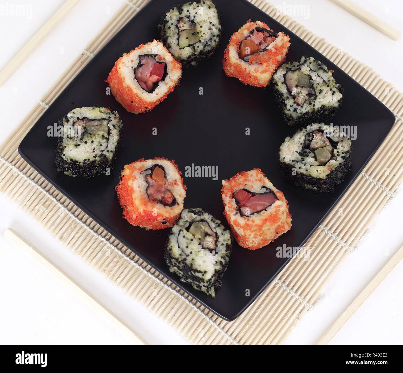 different types of Maki sushi on a black plate Stock Photo - Alamy