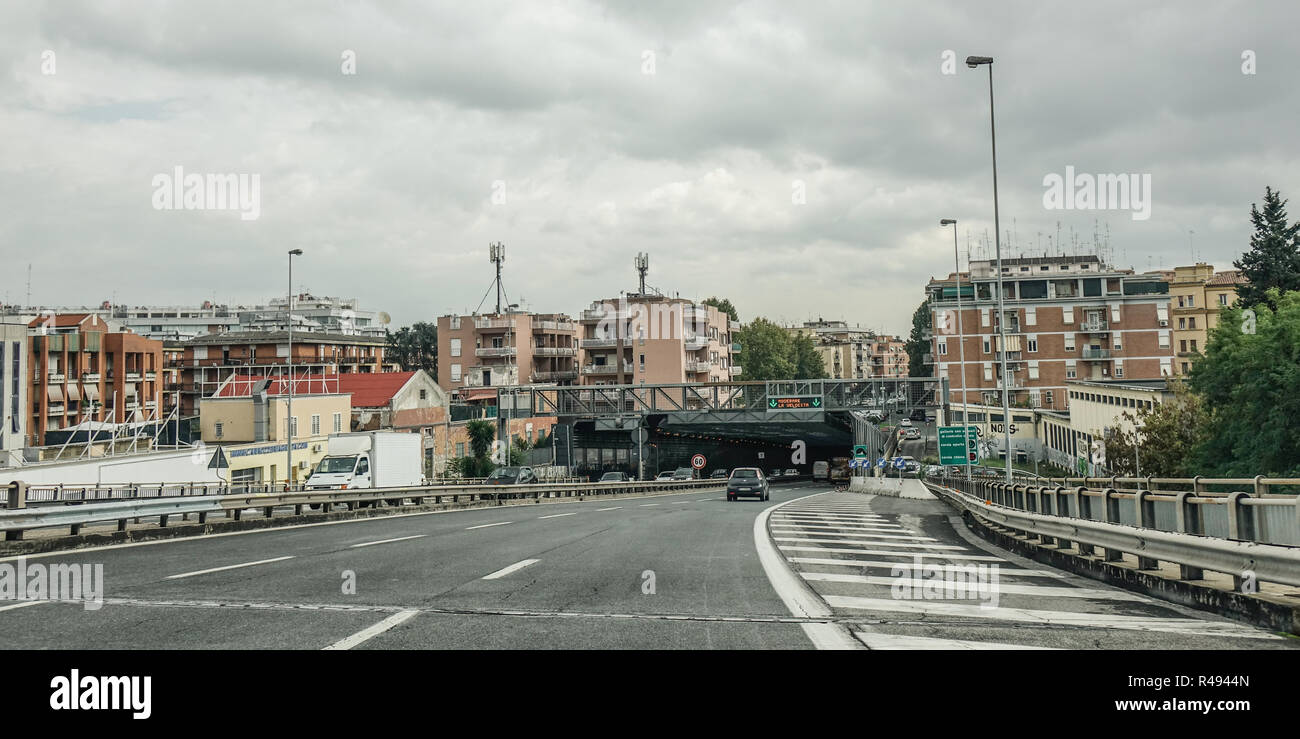 Rome, Italy - Oct 13, 2018. Vehicles run on highway in Rome, Italy. The ...