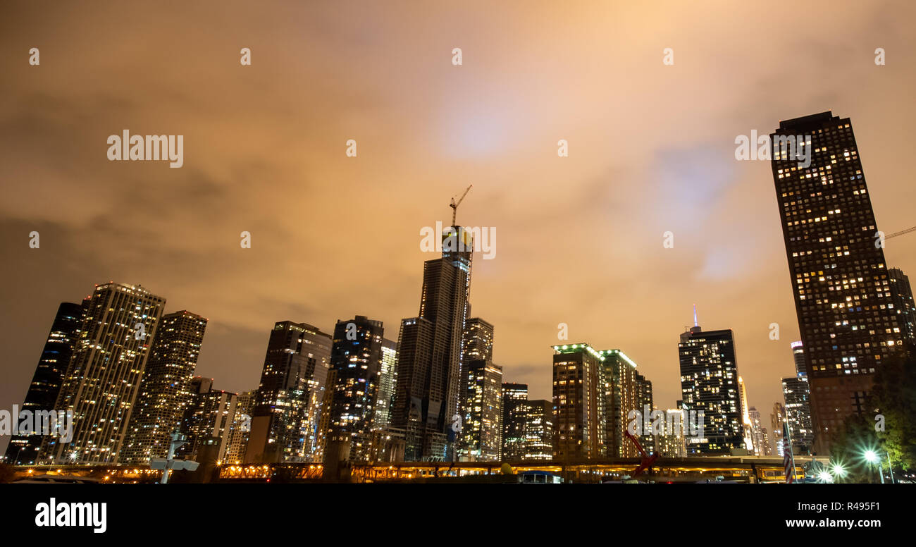 View of the Downtown Chicago Skyline At Night With Cloudy Skies Stock ...