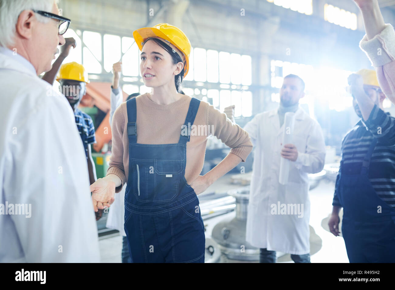 Female Worker Talking to Boss Stock Photo - Alamy