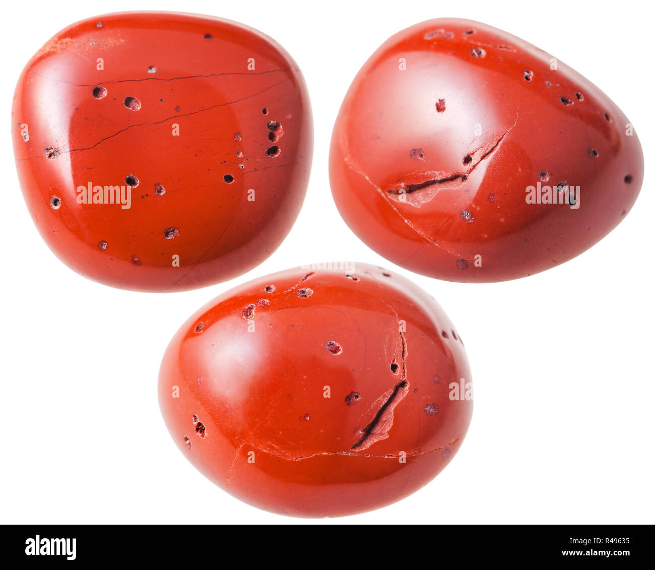 three red coral gemstones isolated on white Stock Photo - Alamy