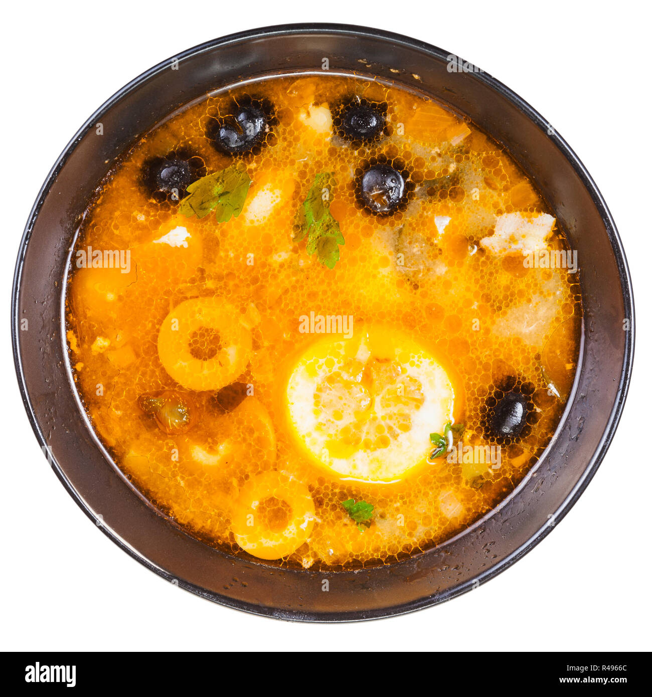 top view of Solyanka fish soup in bowl isolated Stock Photo - Alamy