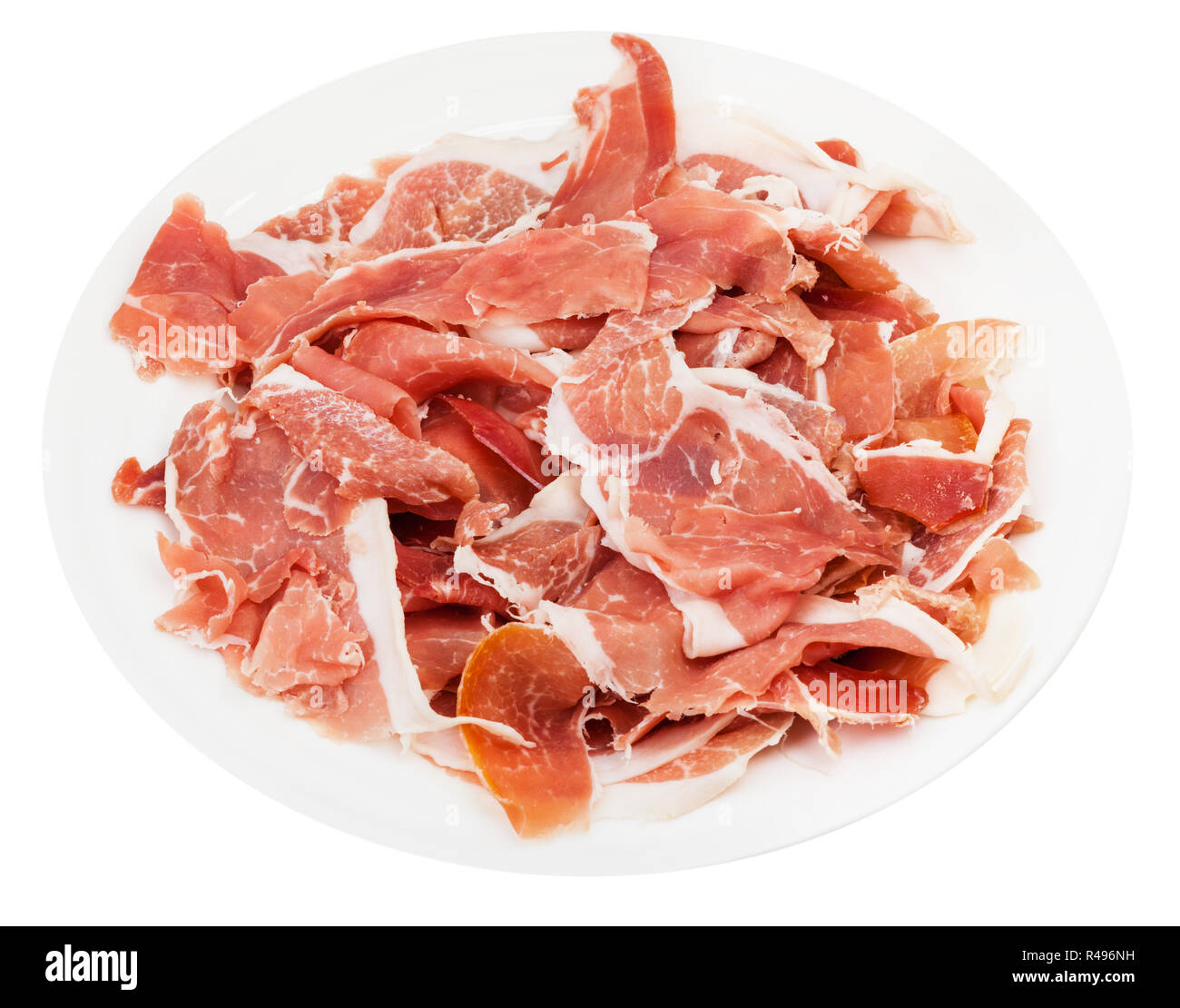 thin sliced prosciutto crudo on plate isolated Stock Photo - Alamy