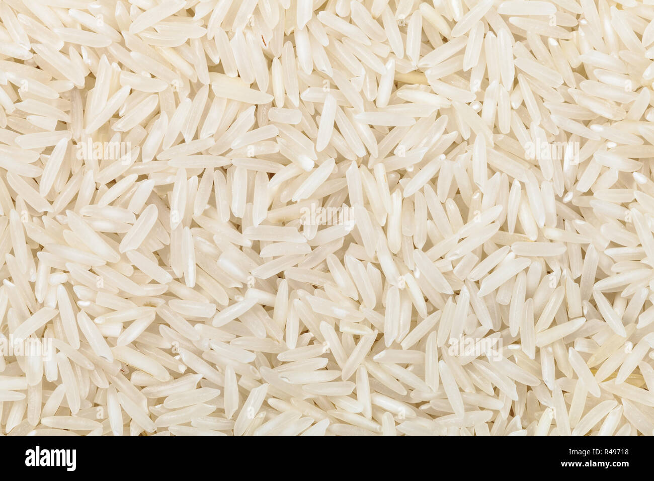 long-grain uncooked white Basmati rice Stock Photo - Alamy