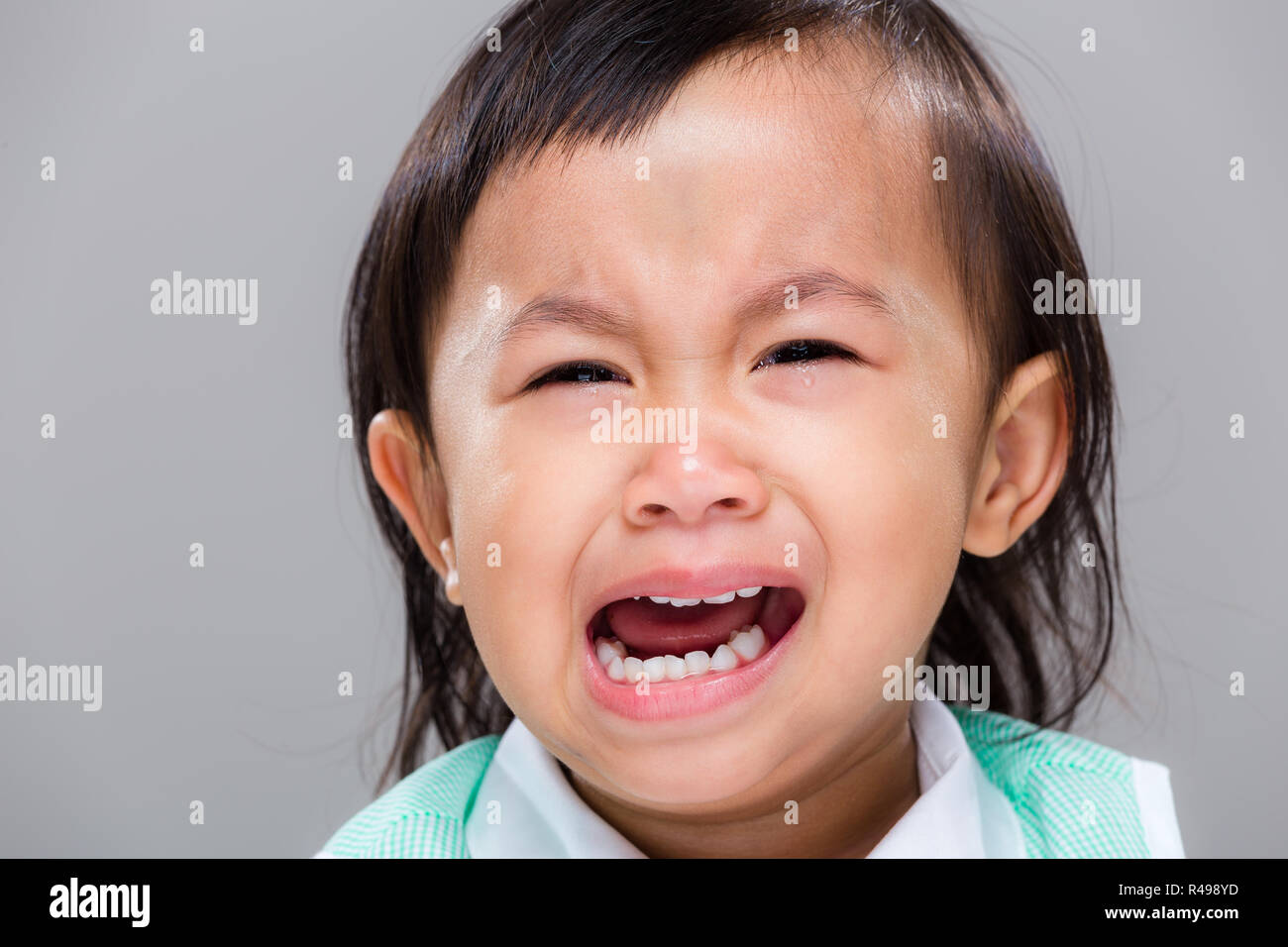 Baby girl cry close up Stock Photo - Alamy