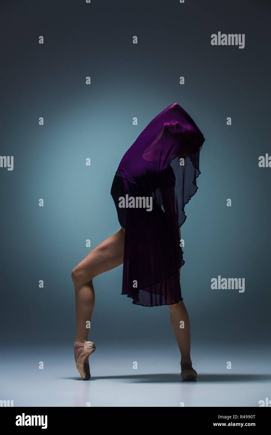 Young beautiful modern style dancer posing on a studio background Stock ...