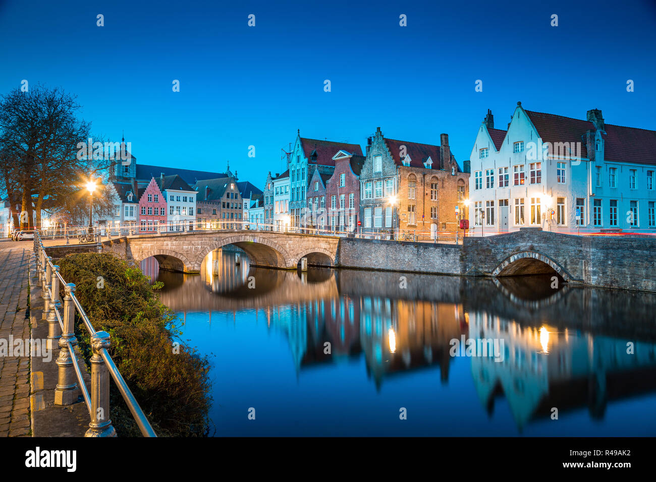 Classic panoramic twilight view of the historic city center of Brugge ...