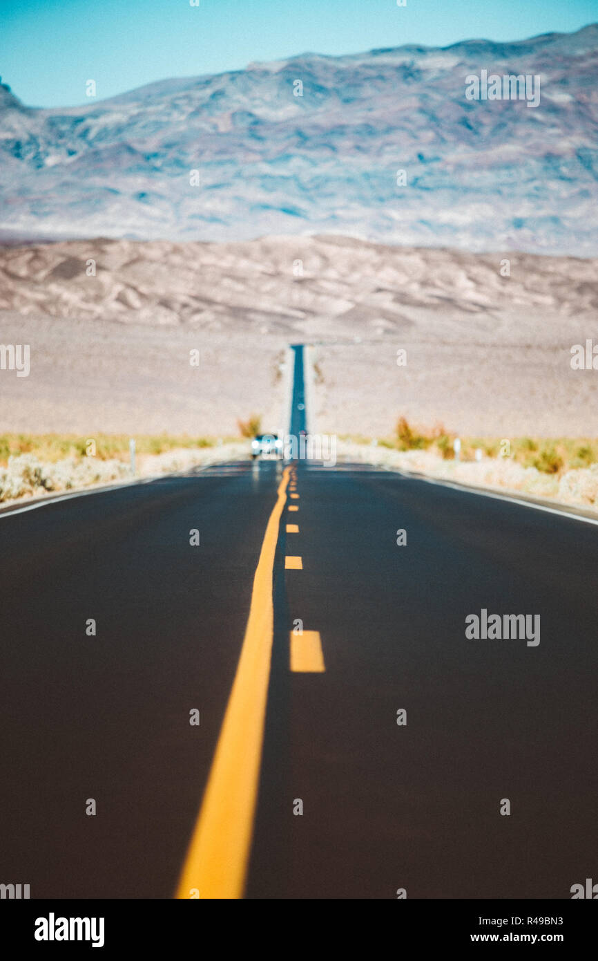 Classic panorama view of an endless straight road running through the ...