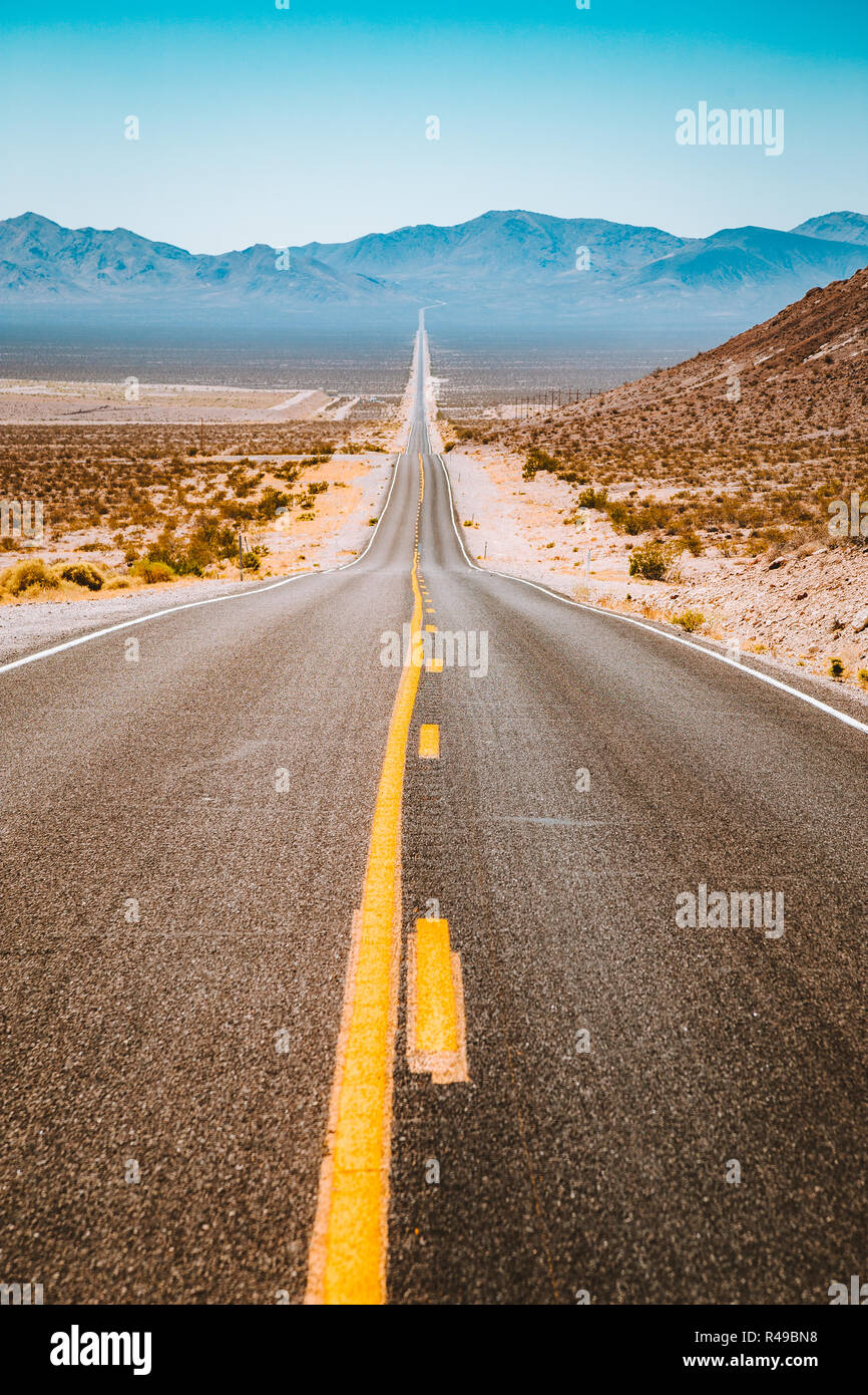 Classic panorama view of an endless straight road running through the ...