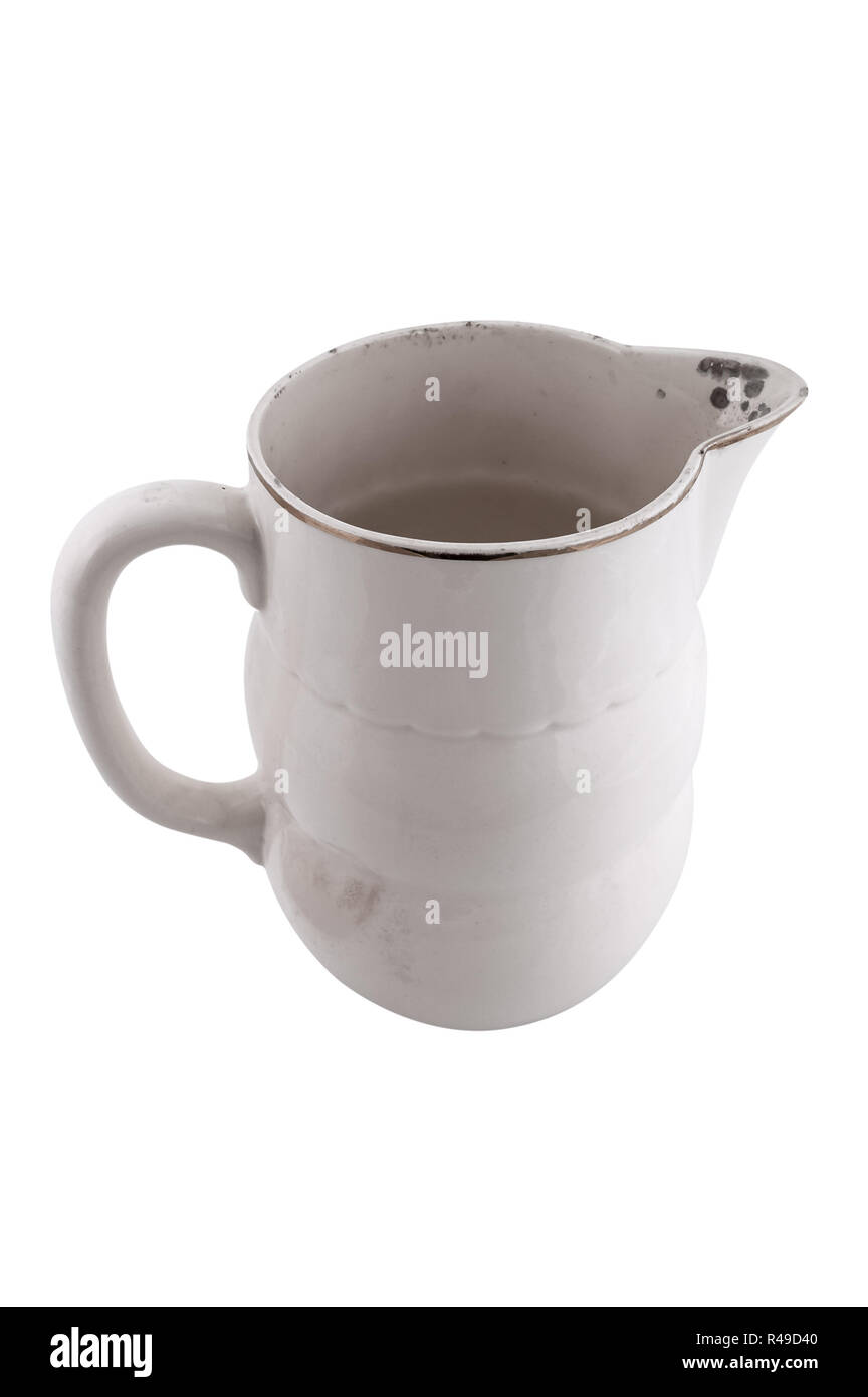 Single isolated empty pitcher with scuffed glazed ceramic surface and ...