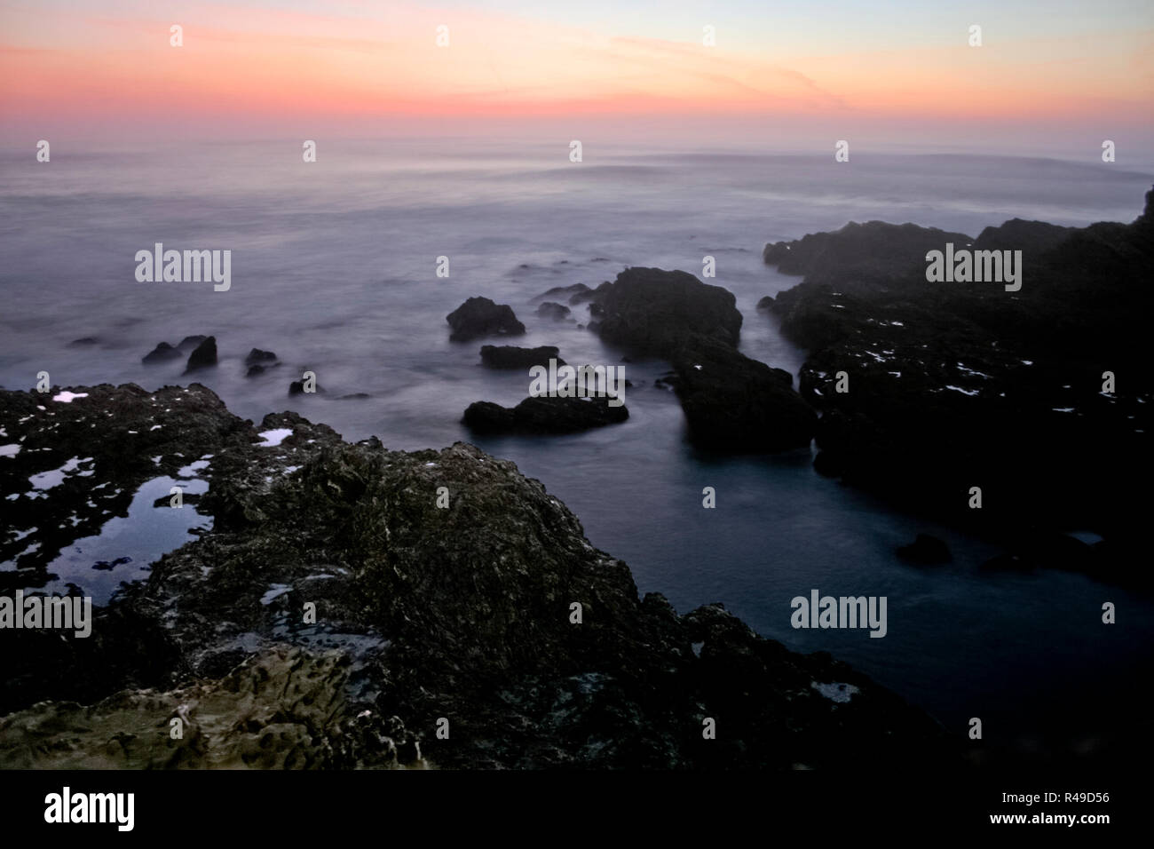 Rocks and sunset Stock Photo - Alamy