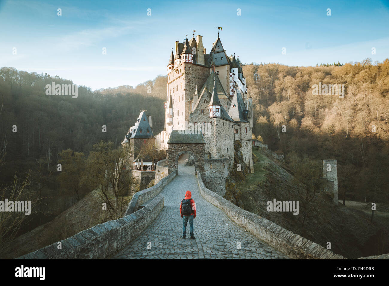 Panorama view of young explorer with backpack taking in the view at ...
