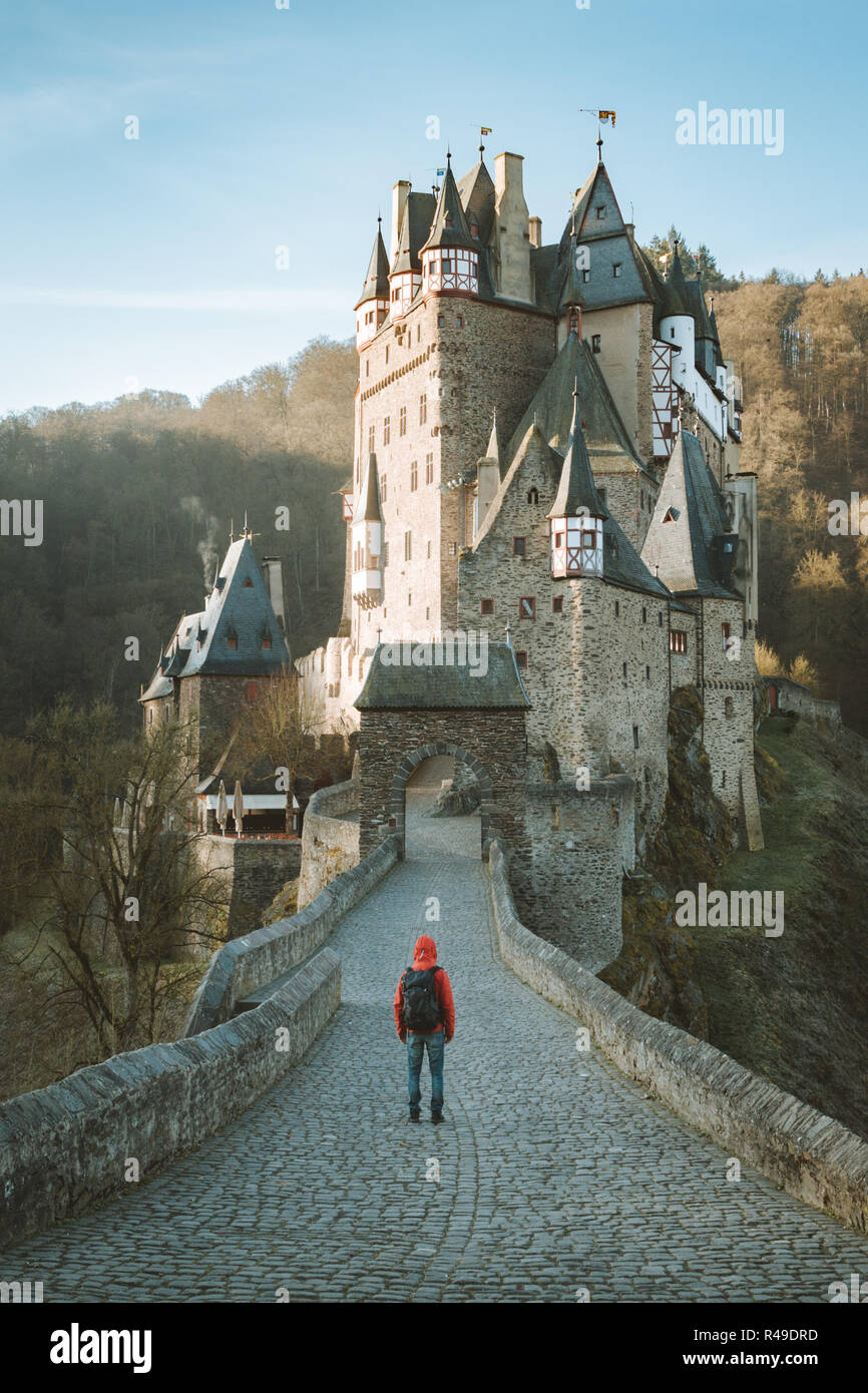 Panorama view of young explorer with backpack taking in the view at ...