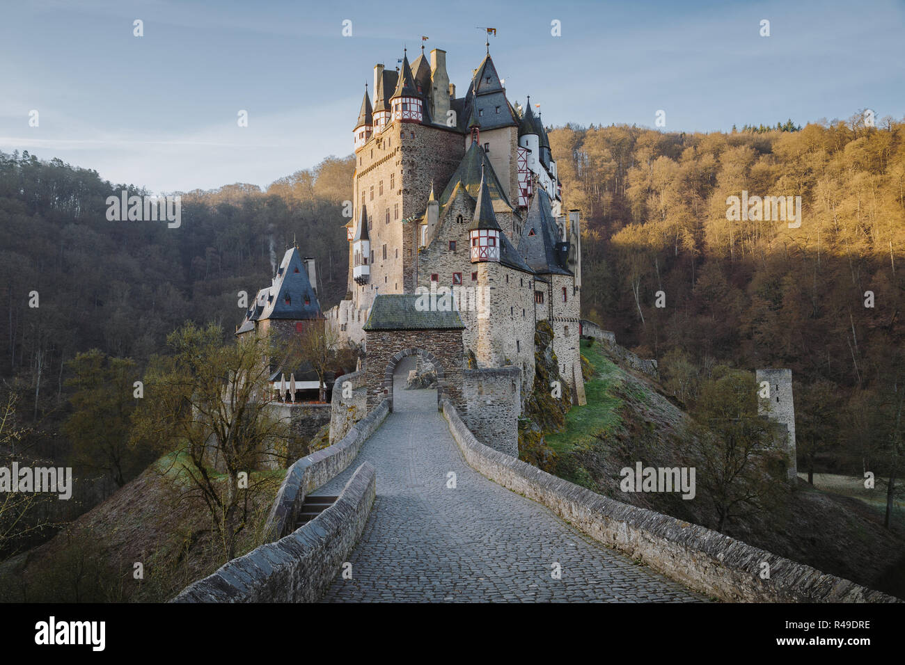 Beautiful view of famous Eltz Castle in scenic golden morning light at ...