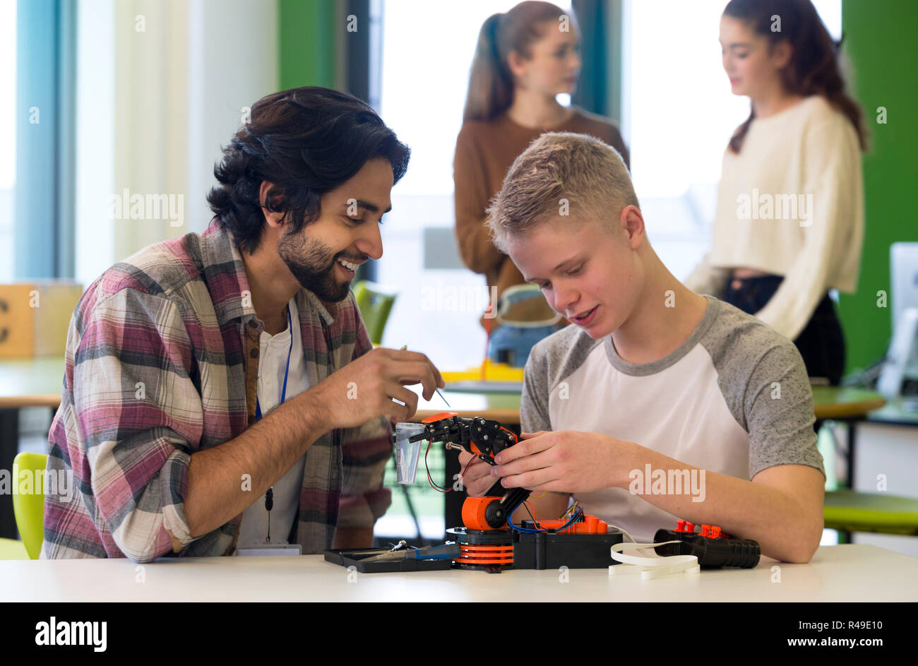 Student and Teacher Working Together Stock Photo - Alamy
