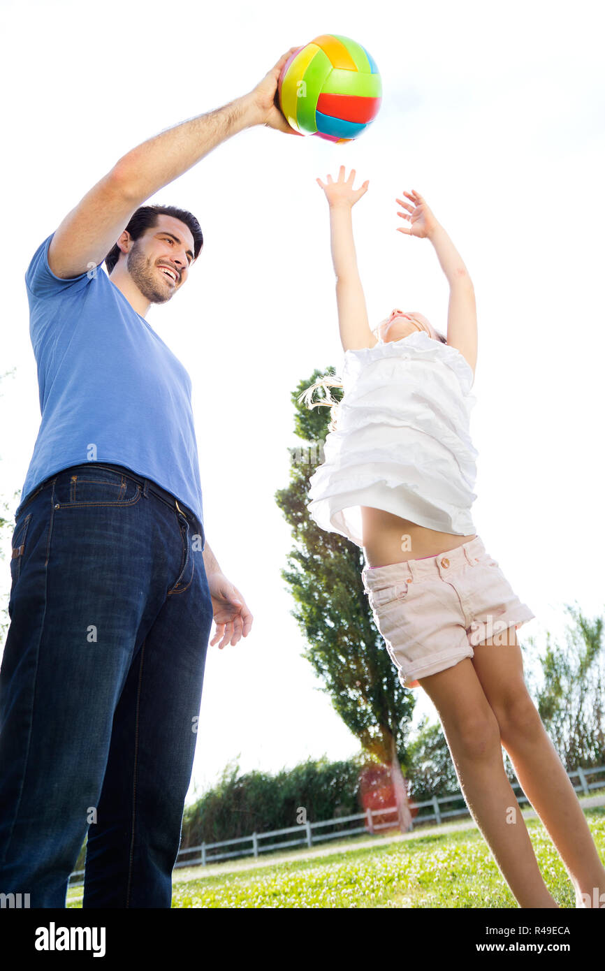 happy young family, father and son playing ball in the park Stock Photo ...
