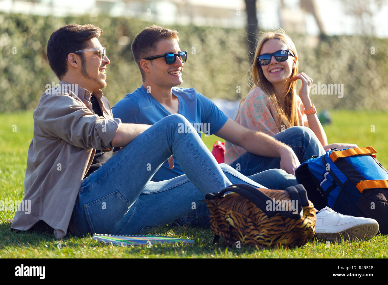 A group of friends talking in the street after class Stock Photo - Alamy