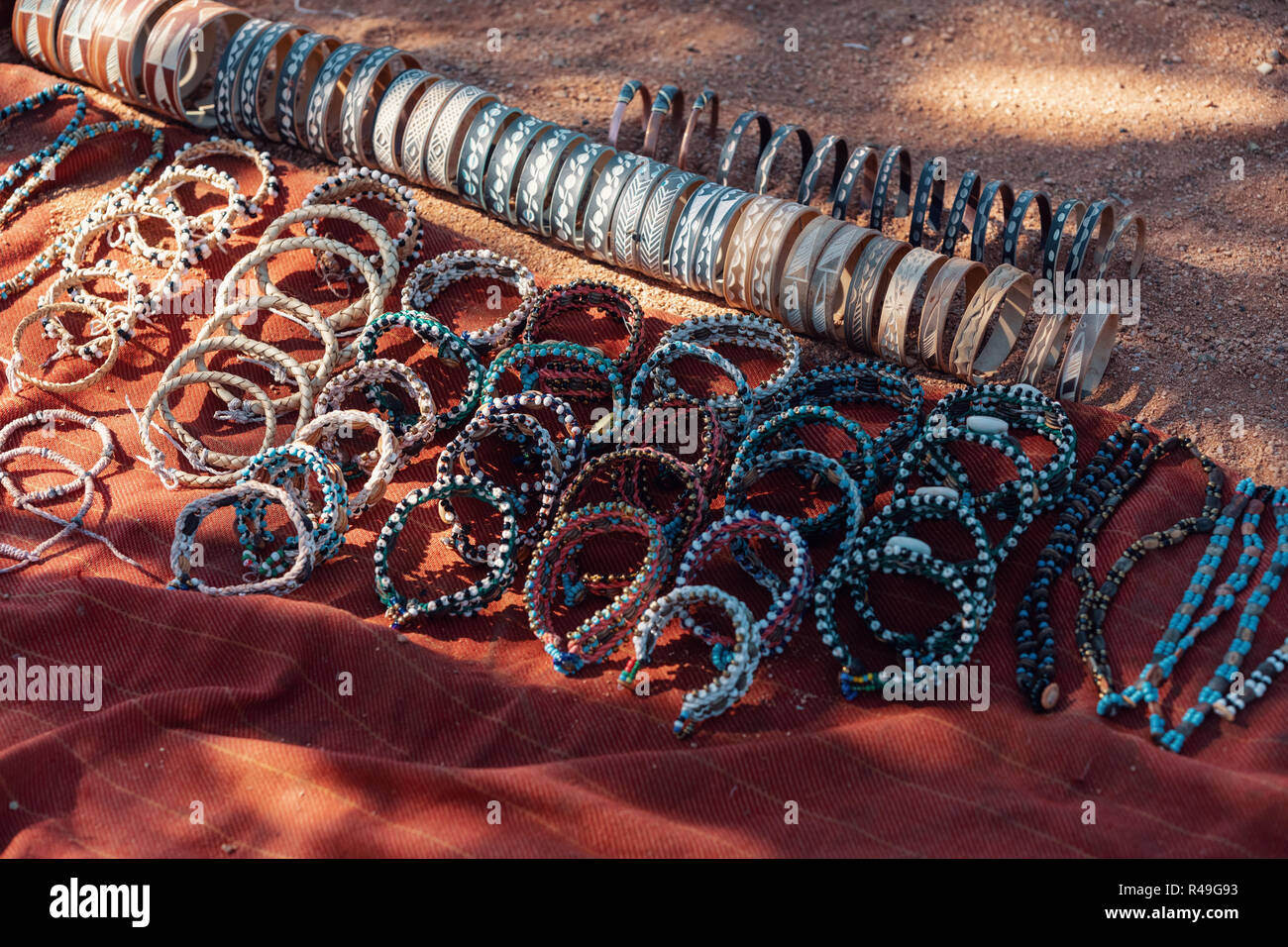 traditional souvenirs from himba peoples for tourists, exposed on sandy ...