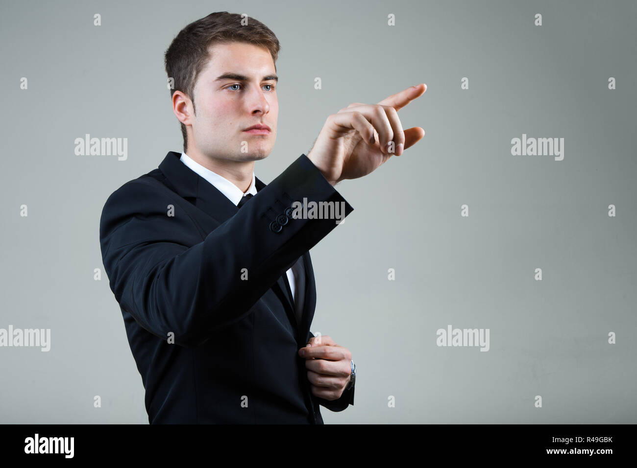 Business man with pointing to something or touching a screen Stock ...