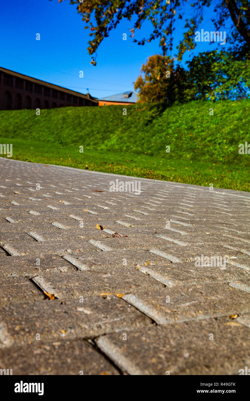 Stone path in the park and green lawn. Beautiful summer city park for ...