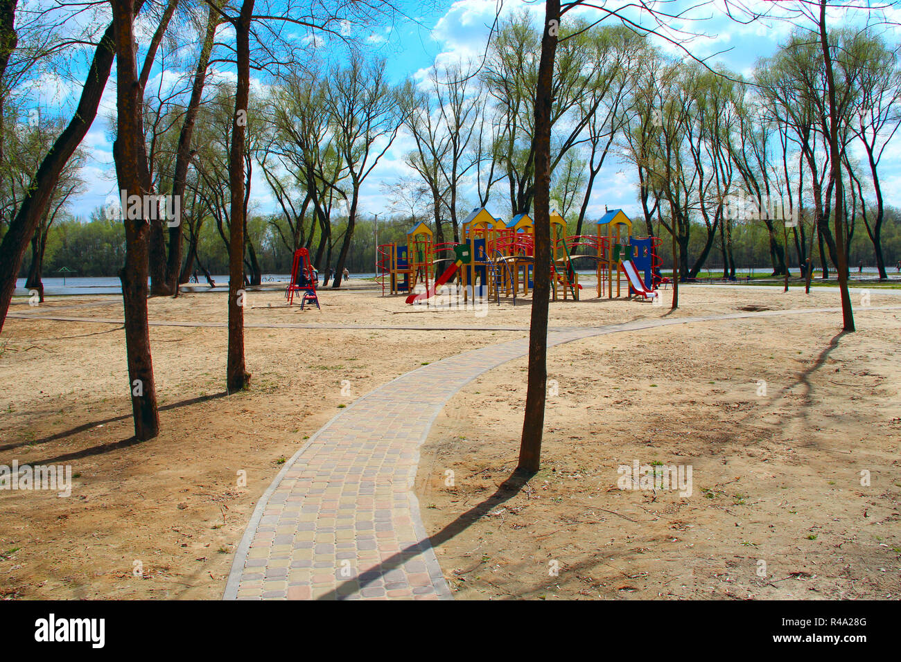 Footpath leading to childish playground in city park. Park for children ...