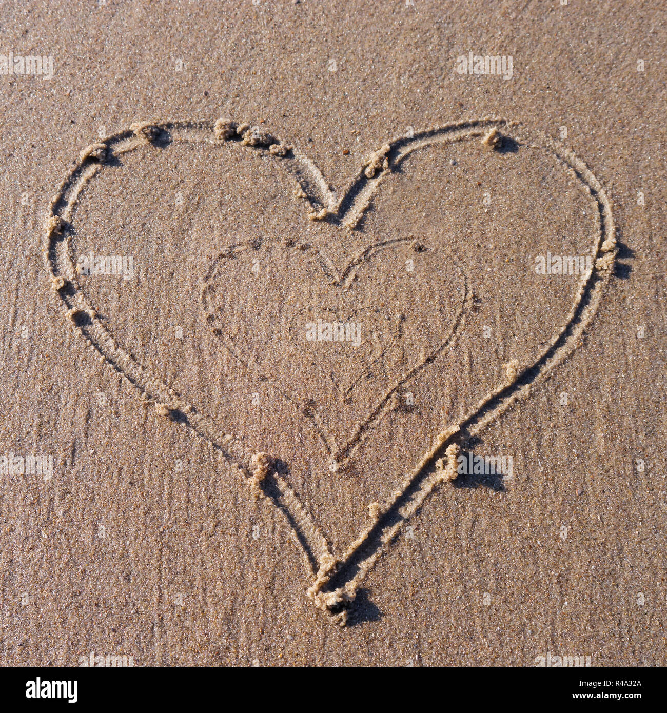 heart in sand Stock Photo - Alamy